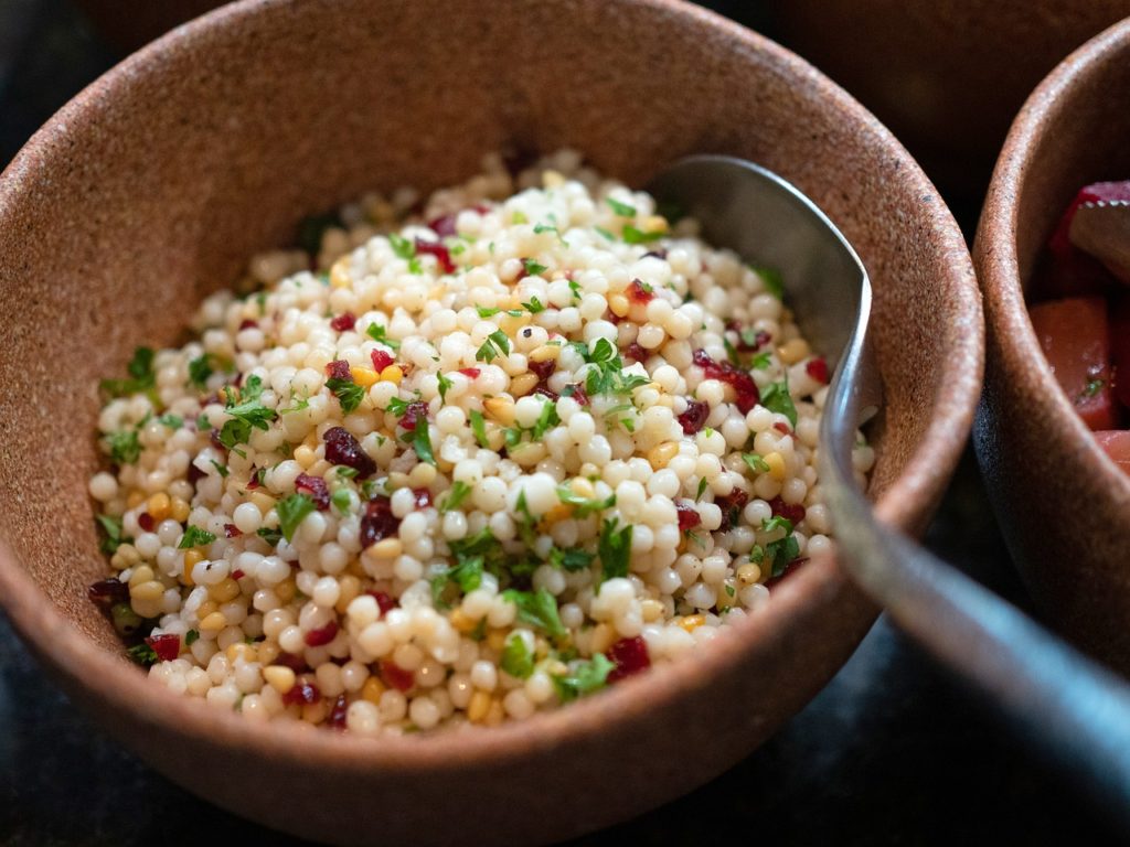 Curried Cous Cous with dried fruit and scallion - We're Only Cumin